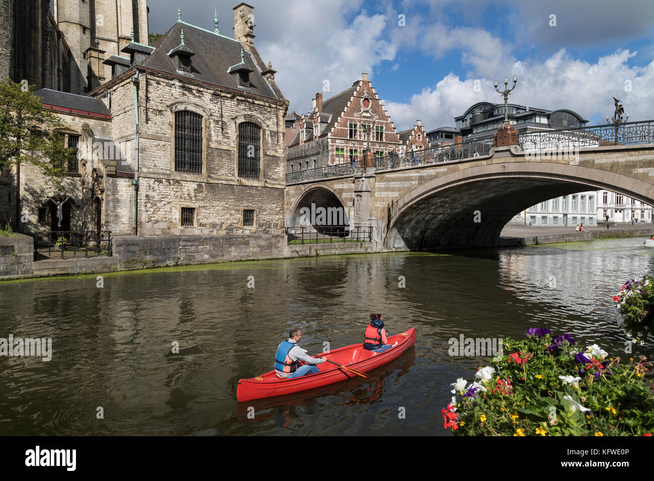 The Leie river near Saint Michael's Church in the historic city of ...