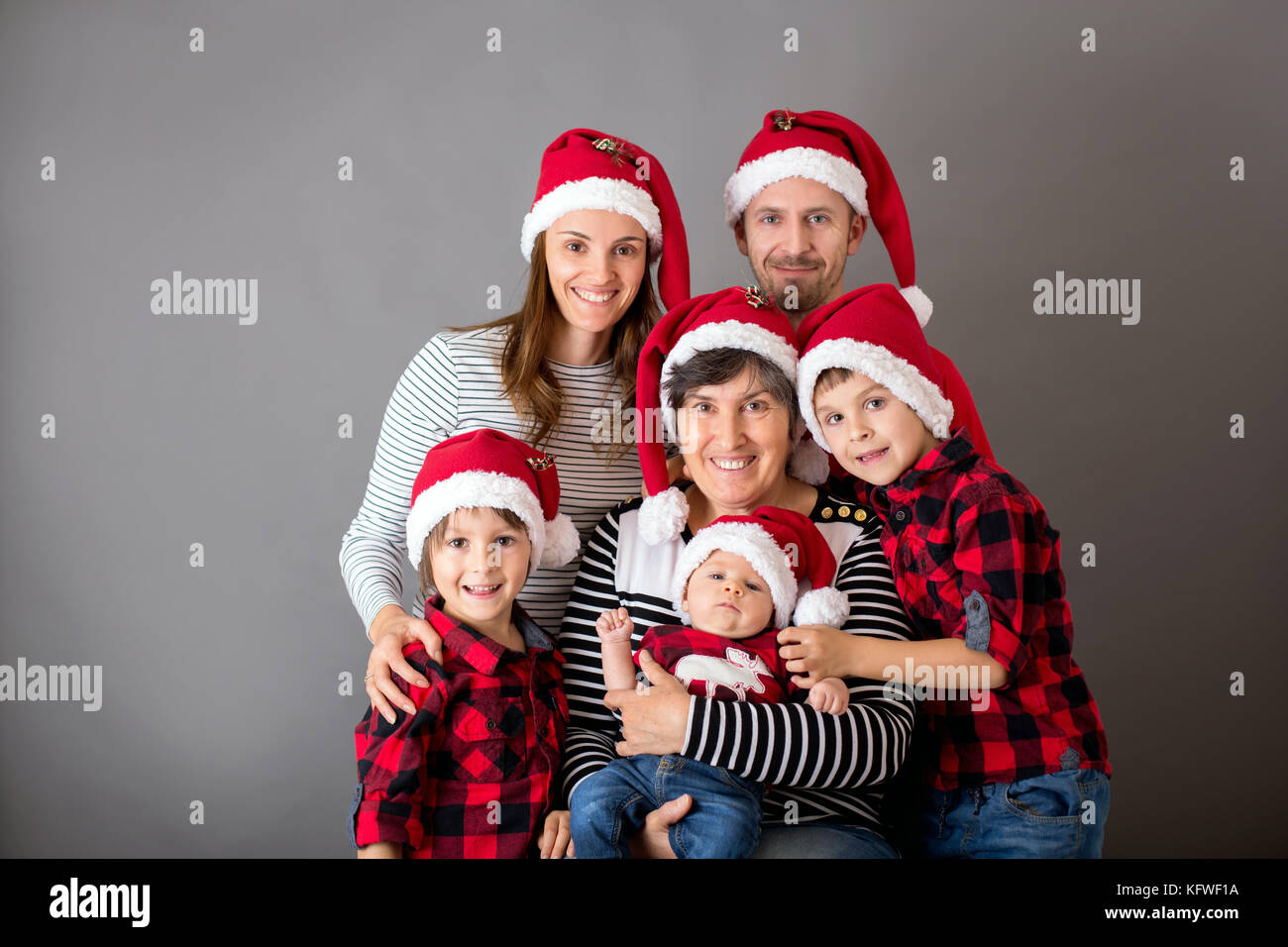 Family christmas portrait, isolated on gray, studio image, people with ...