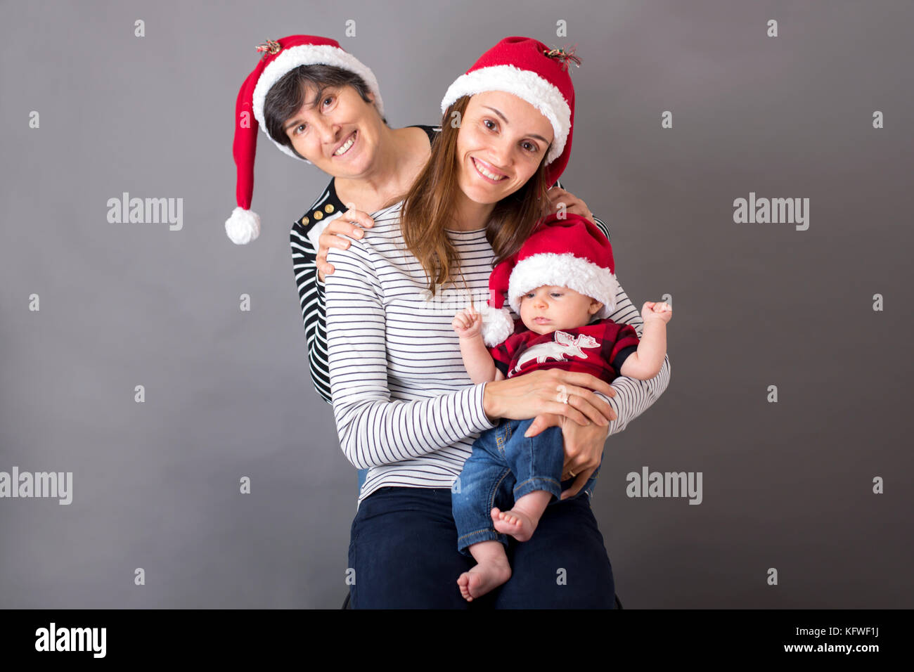 Family christmas portrait, isolated on gray, studio image, people with ...