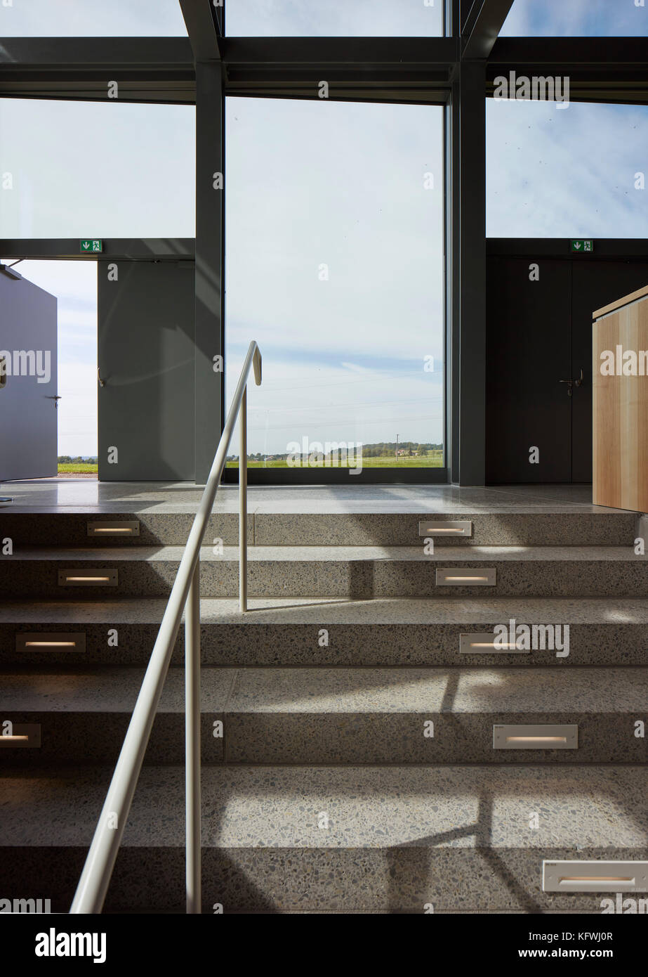 Staircase to circulation gallery with full-height glazing. Carmen Würth ...