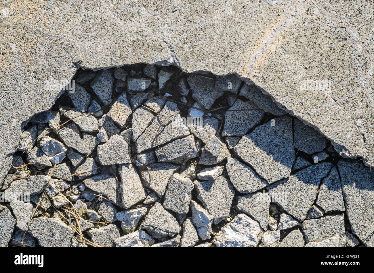 Destroyed concrete floor texture. Large broken pieces of concrete ...