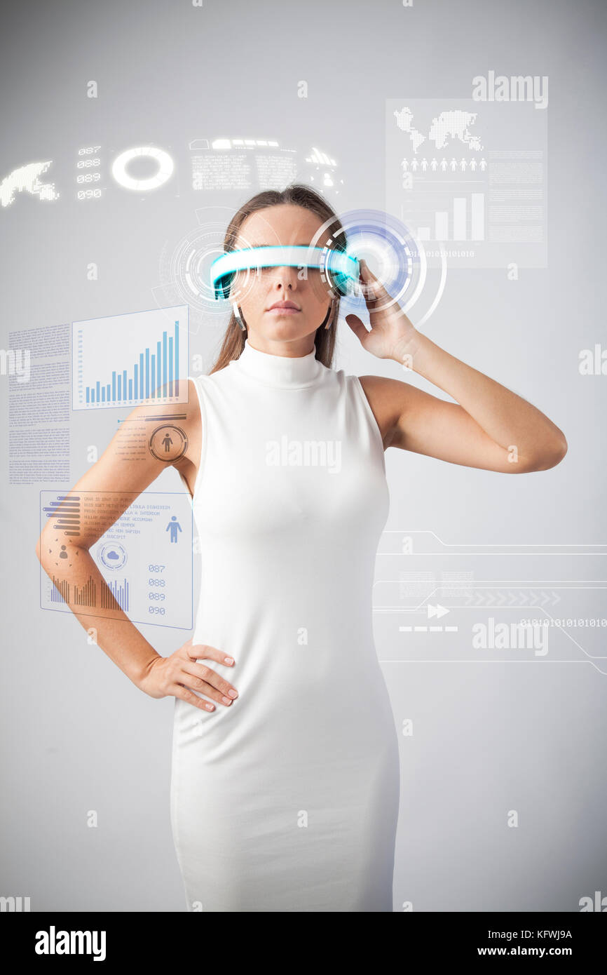 Young woman with smart-glasses front of virtual future interface Stock ...