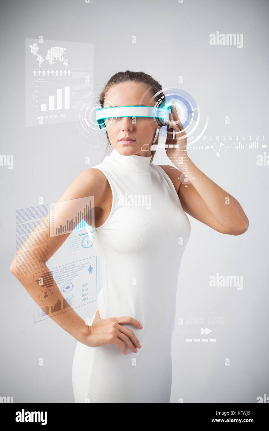 Young woman with smart-glasses front of virtual future interface Stock ...