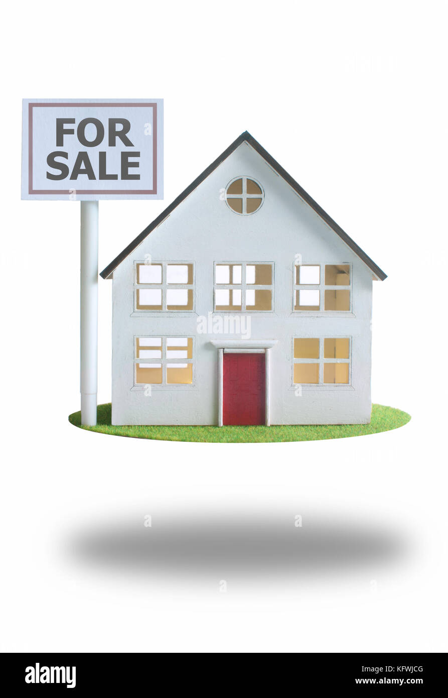House for sale floating on grass platform Stock Photo - Alamy
