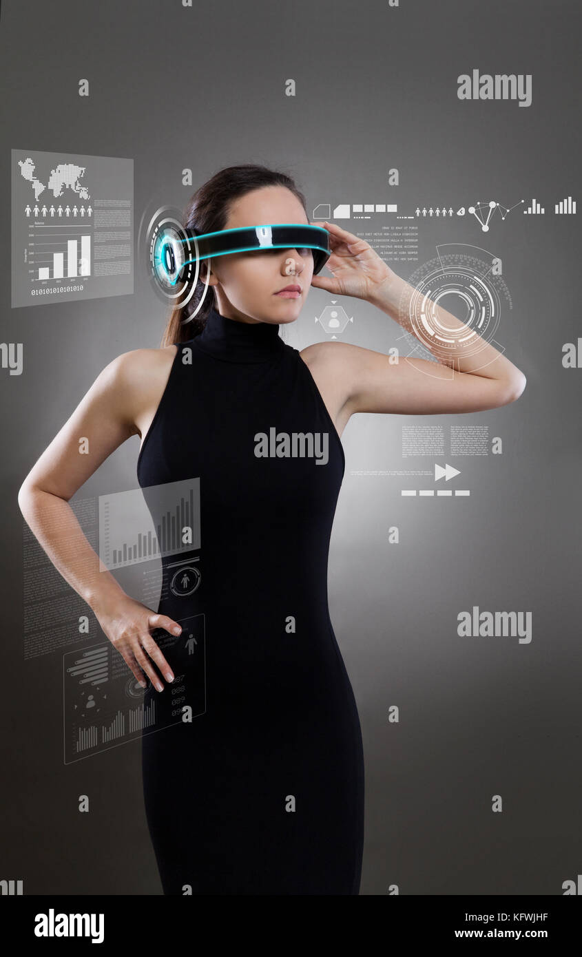 Young woman with smart-glasses front of virtual future interface Stock ...