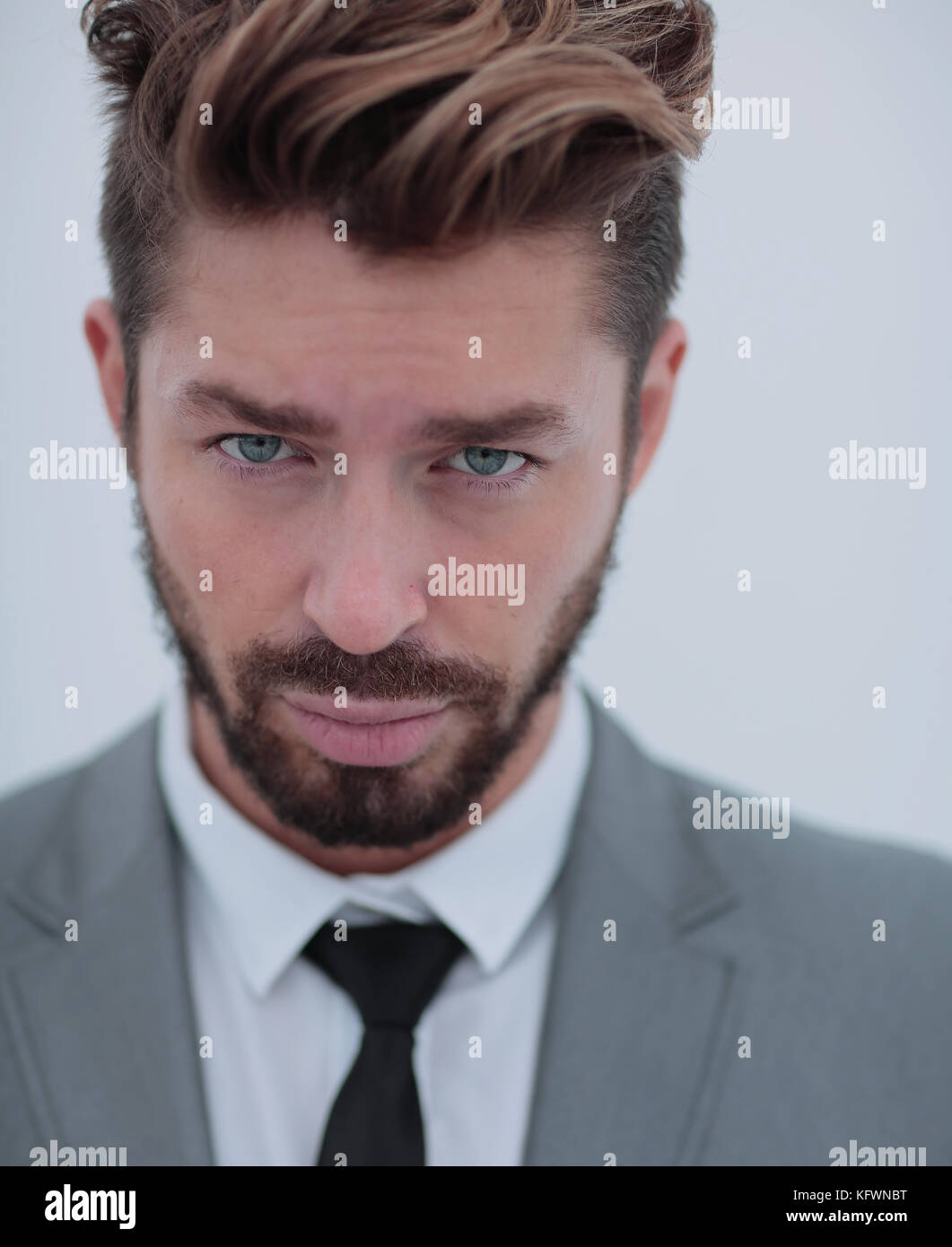 Close up portrait of a smiling handsome business man over white Stock ...