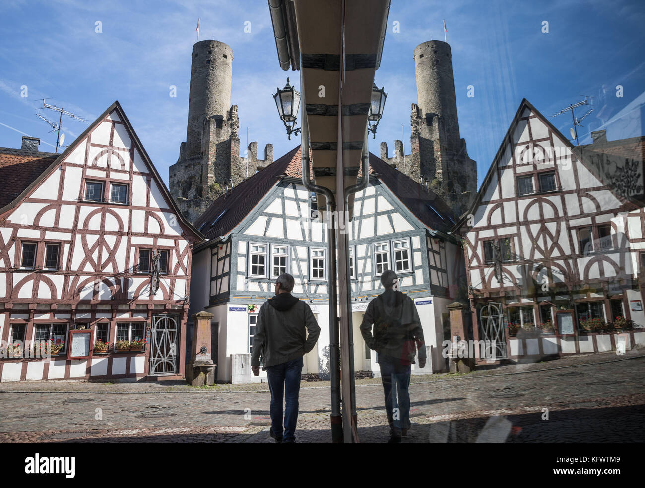 Eppstein, Germany. 1st Nov, 2017. A passerby walks through the historic ...