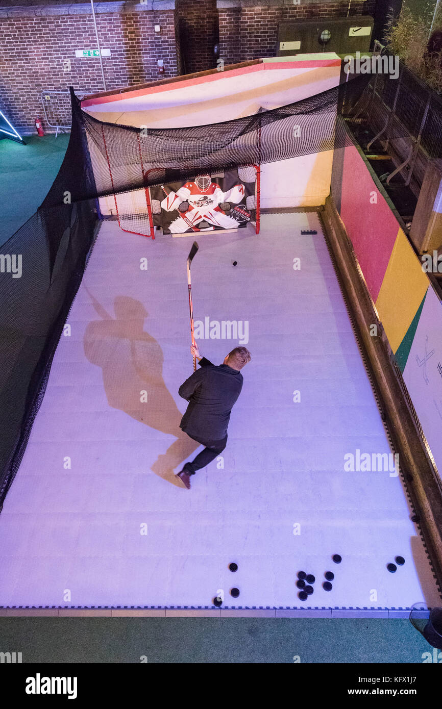 London, UK. 1st Nov, 2017. A man plays ice hockey at the new Skylight ...