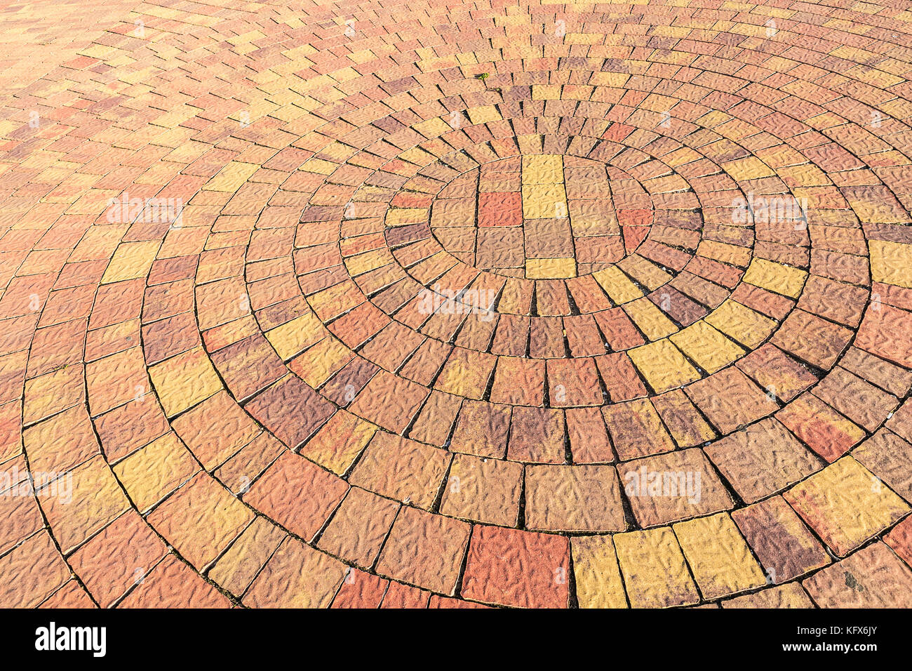 dartboard of bricks. Circular shape on the floor Stock Photo - Alamy
