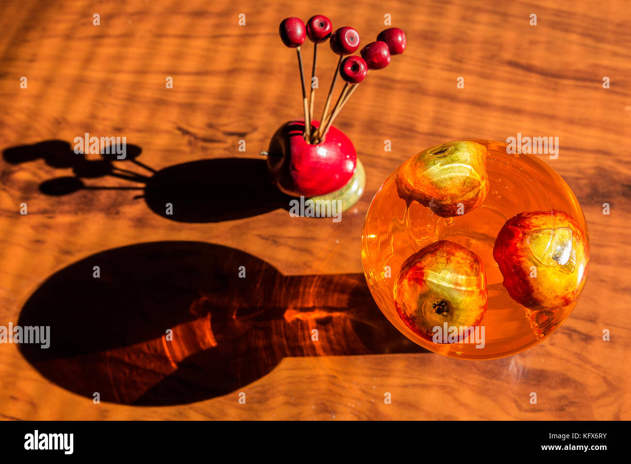 decorative apples inside a glass container on a table Stock Photo - Alamy