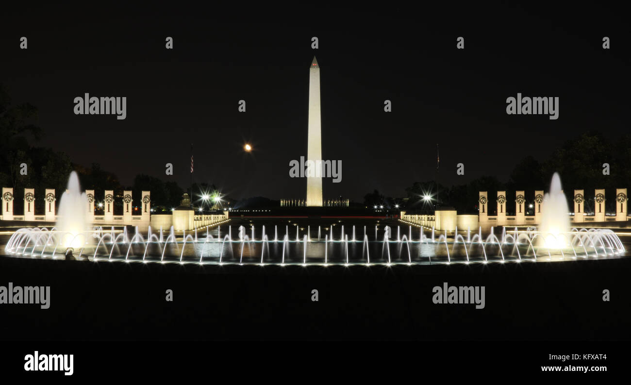 The moon rises over the World War Two memorial fountains and the ...