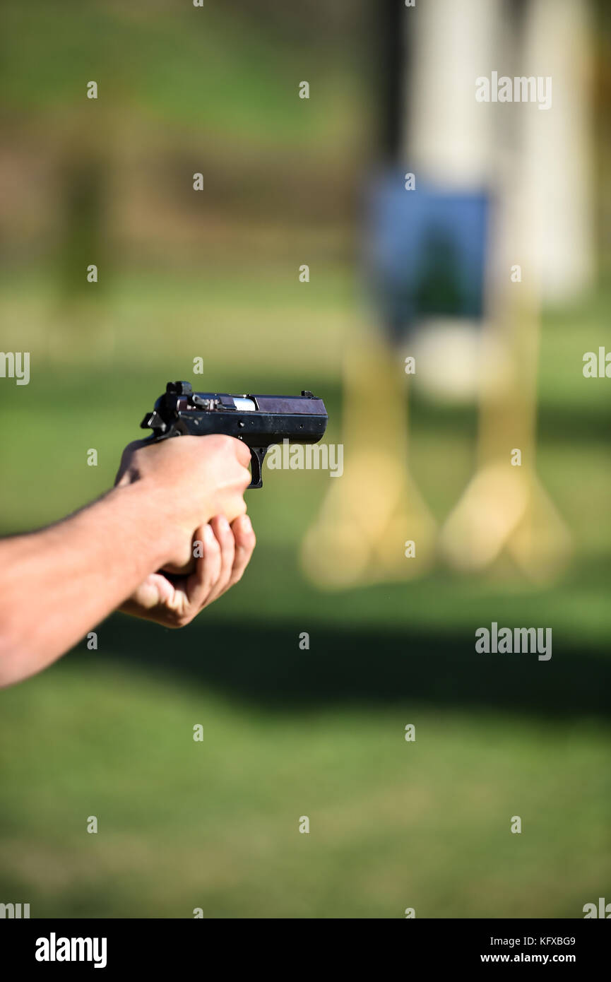 Outdoor shooting with a 9mm pistol in a shooting range Stock Photo - Alamy