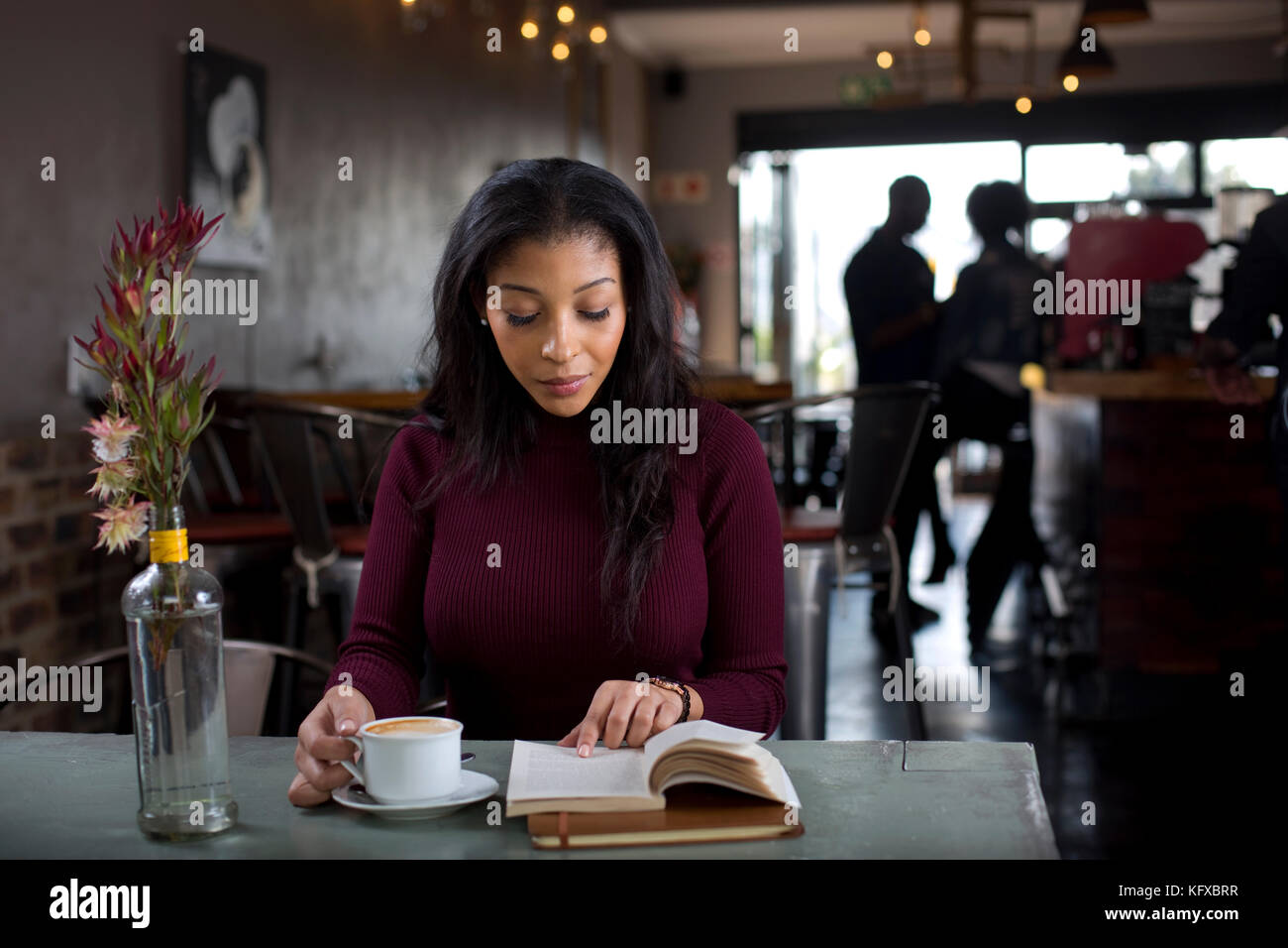 Reading a book at a cafe hi-res stock photography and images - Alamy