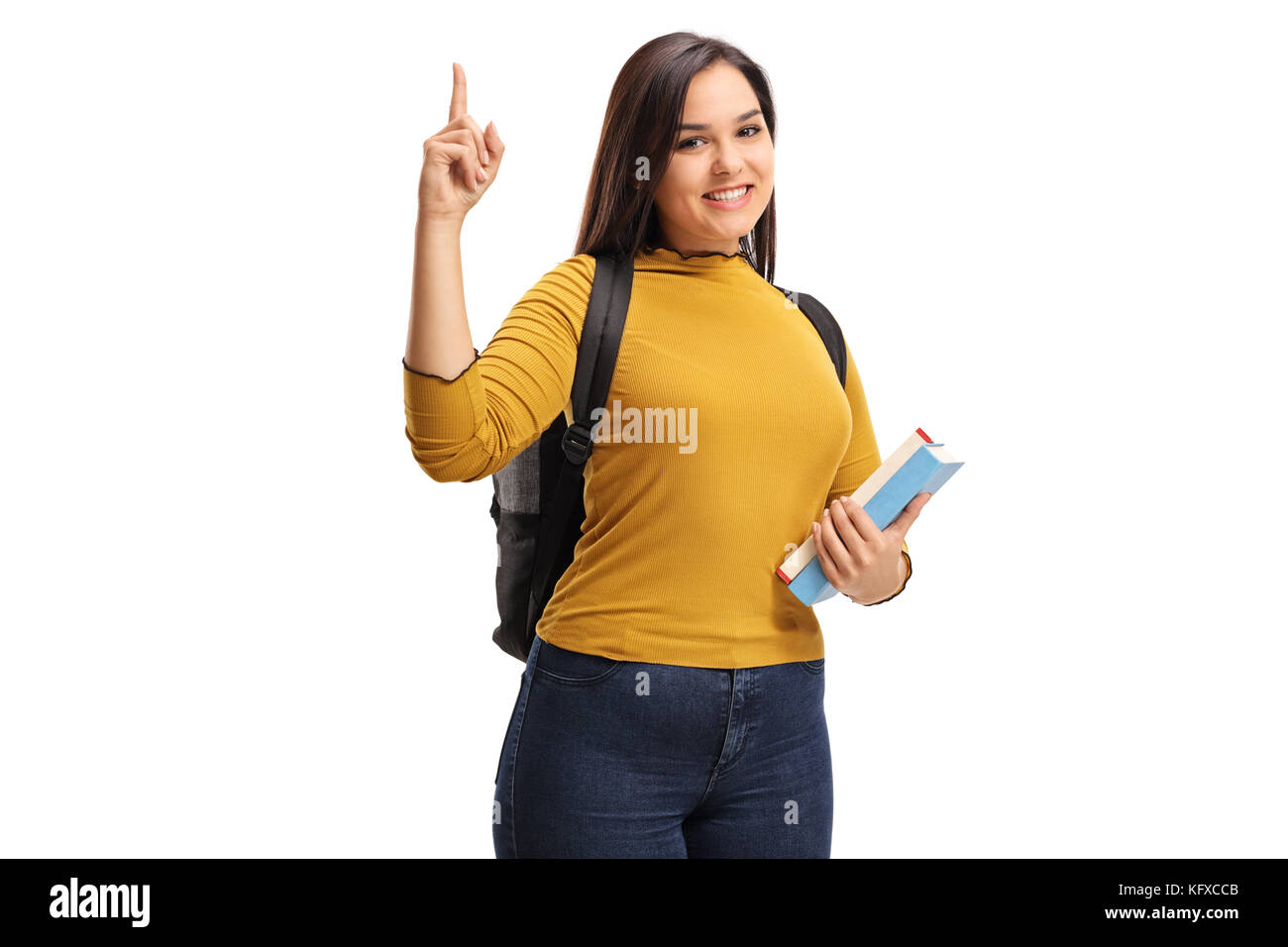 Cheerful teenage student pointing up and smiling isolated on white ...