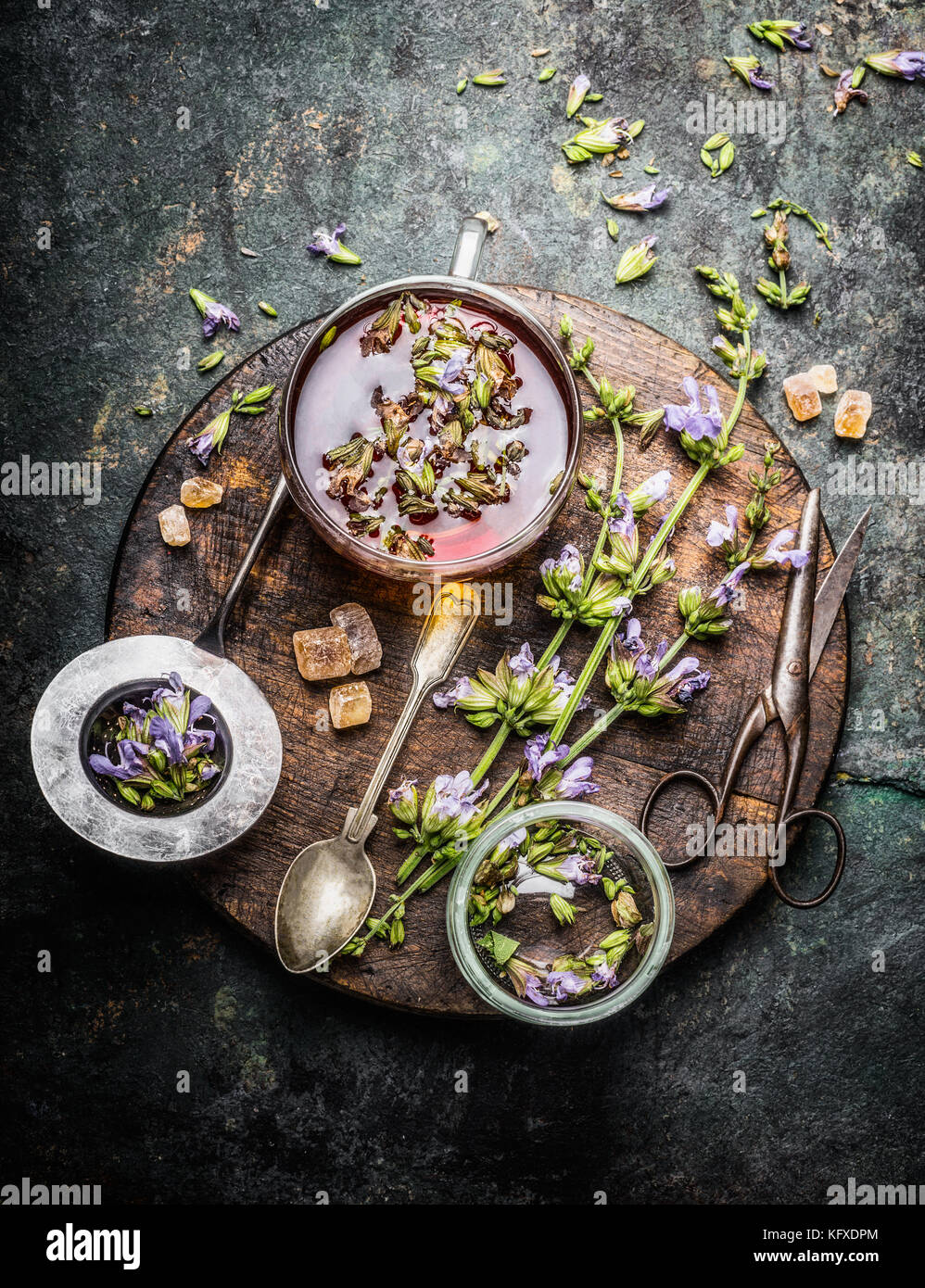 Healthy herbal tea preparation with fresh healing herbs, cup and ...