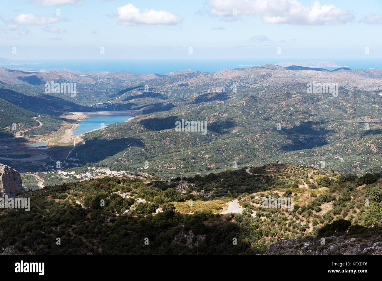 View across mountains of a water reservoir from the mountain road at ...