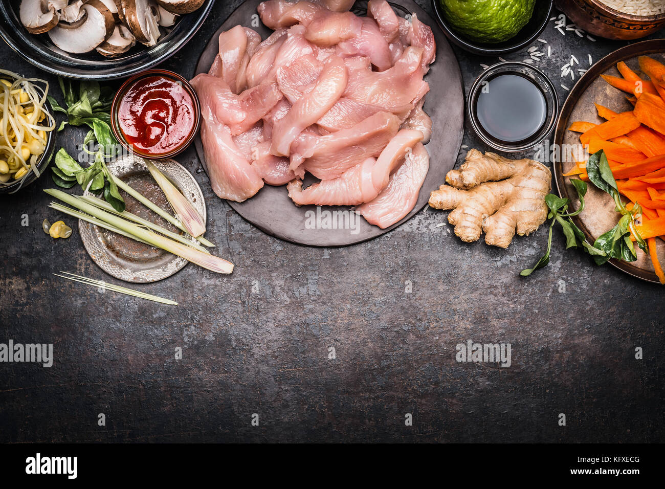 Asian cooking preparation with ingredients : chicken Strips, Shoots ...