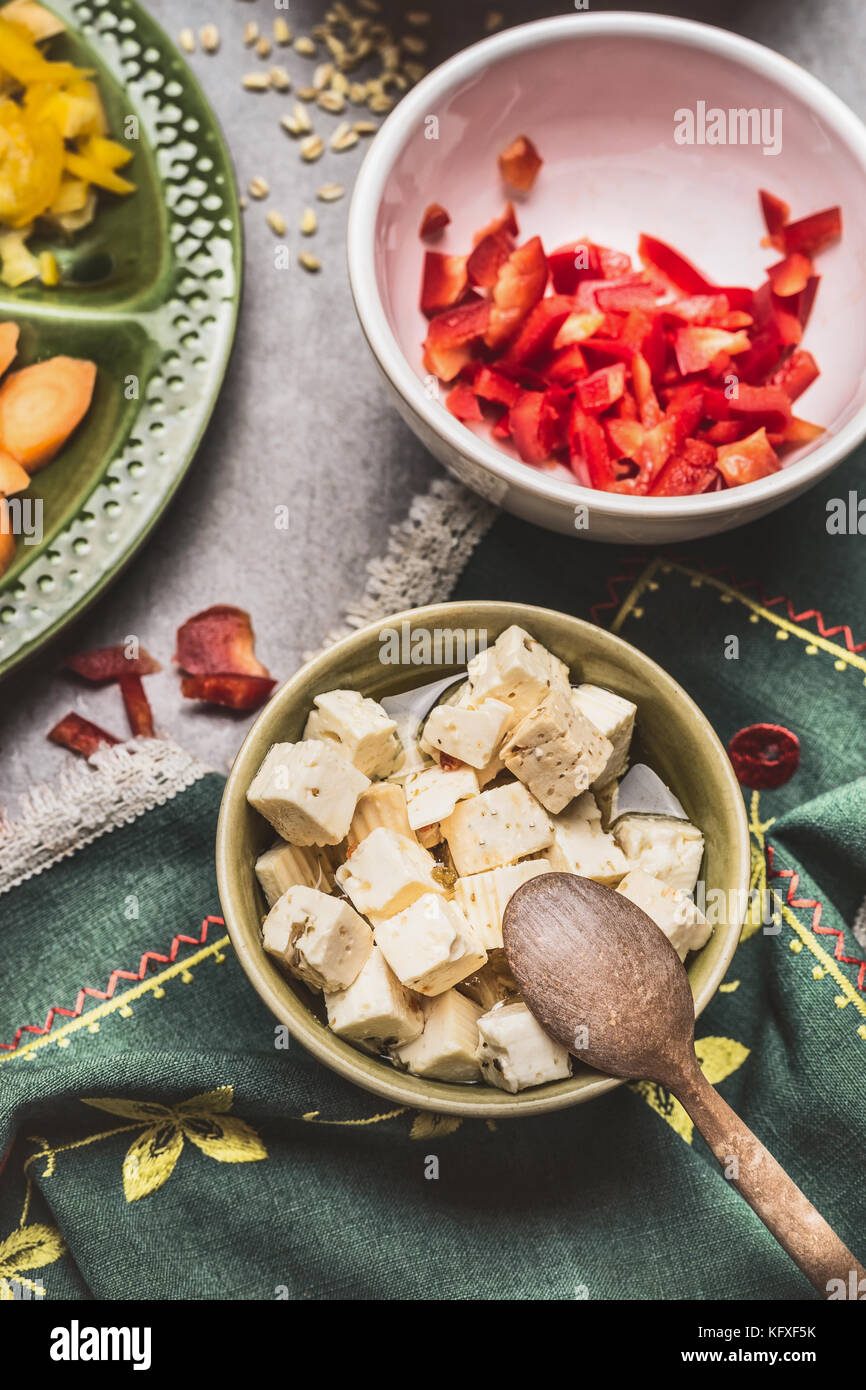 Bowl of Diced feta cheese marinated in olives oil and spoon, top view ...
