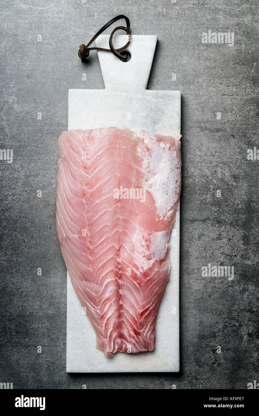 Raw Red fish fillets on marble cutting board , top view Stock Photo - Alamy