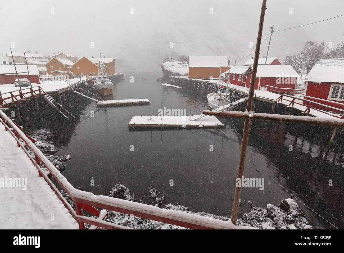 N.E.-wards view over the snowy harbor under heavy snowfall with ...