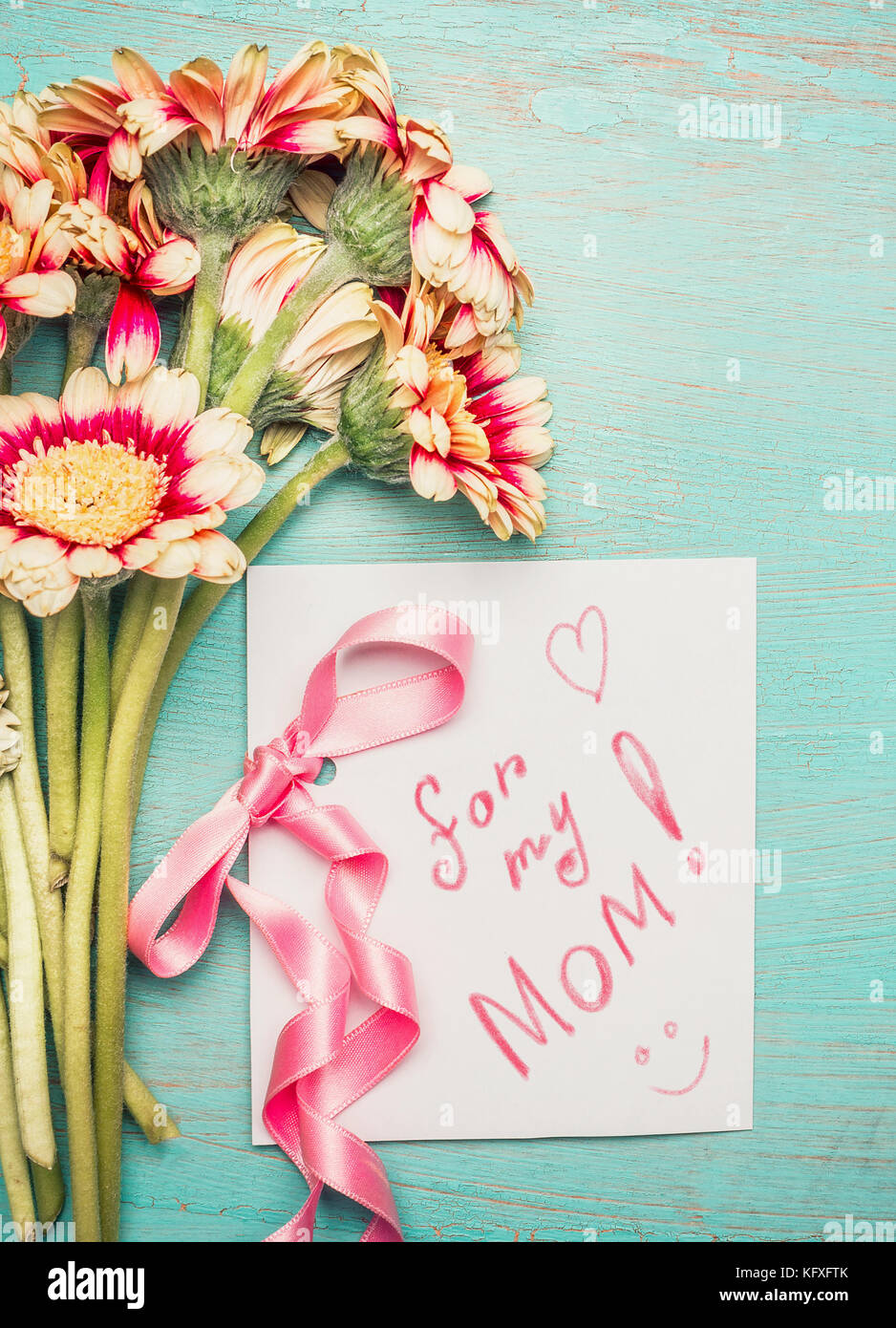 Mothers day card with Flowers bunch , pink ribbon and handwritten text ...