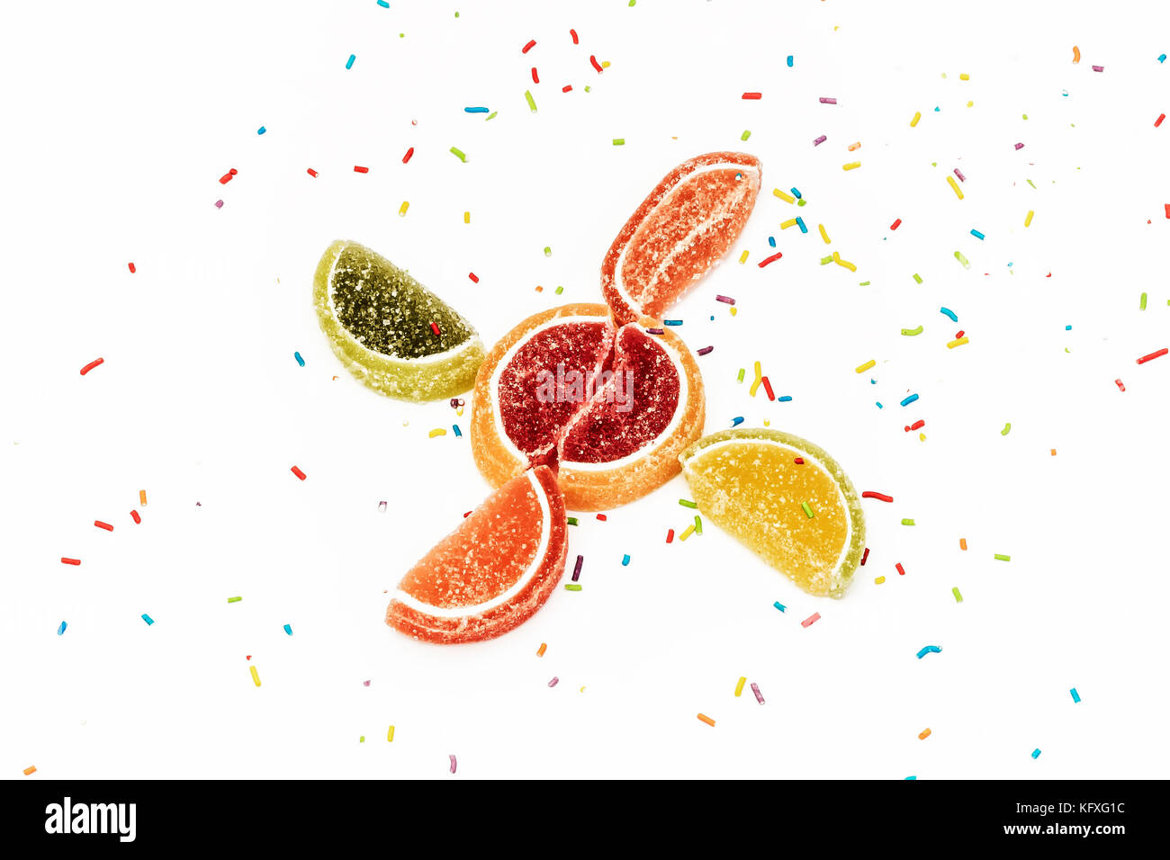 On a white background scattered confectionery powder and lie citrus ...