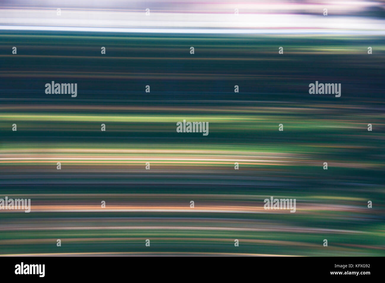 Abstract blurry soft and smooth dark colorful lines in fast motion ...