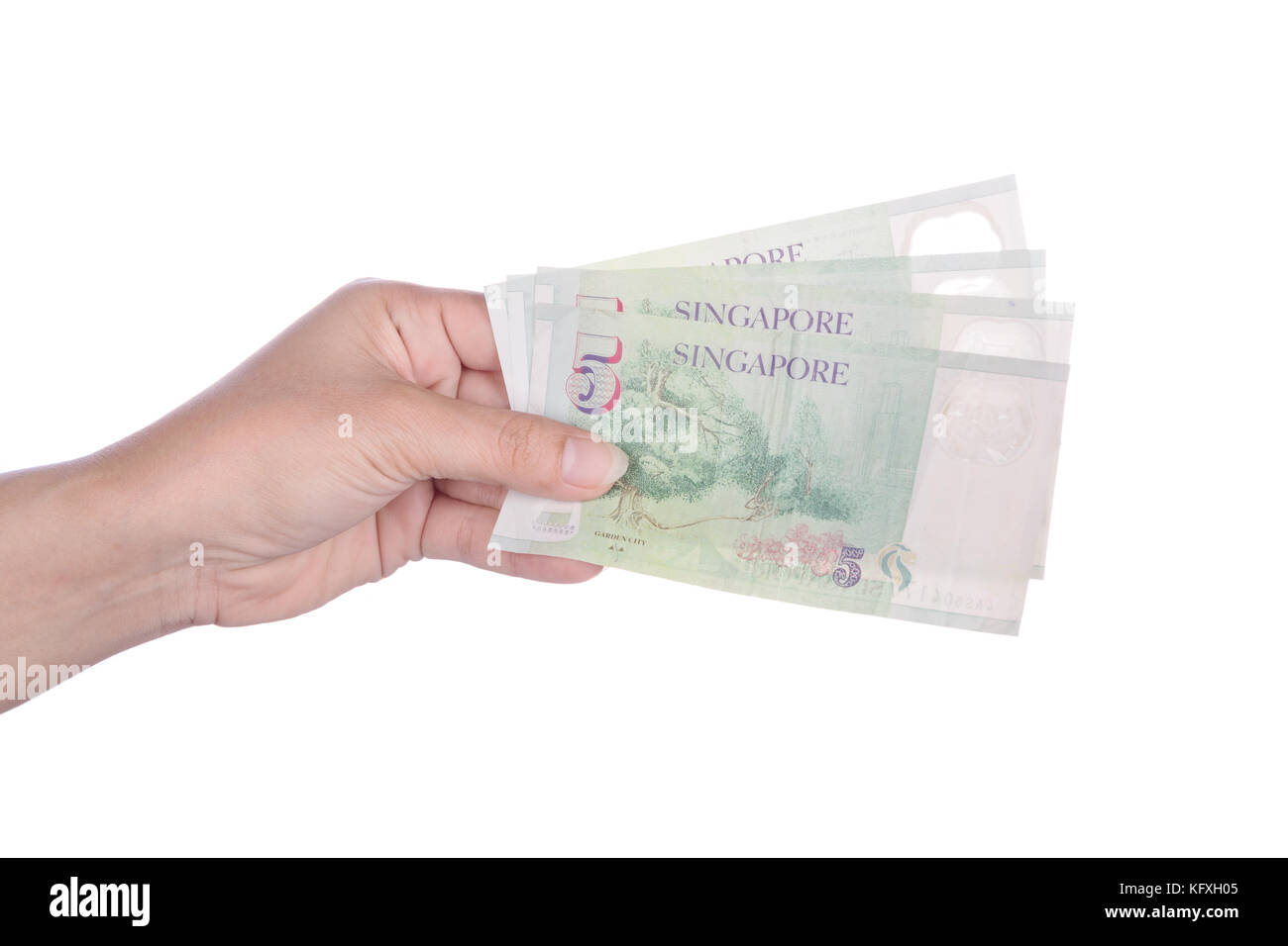 hand with Singapore banknotes dollars (5 SGD) isolated on a white ...