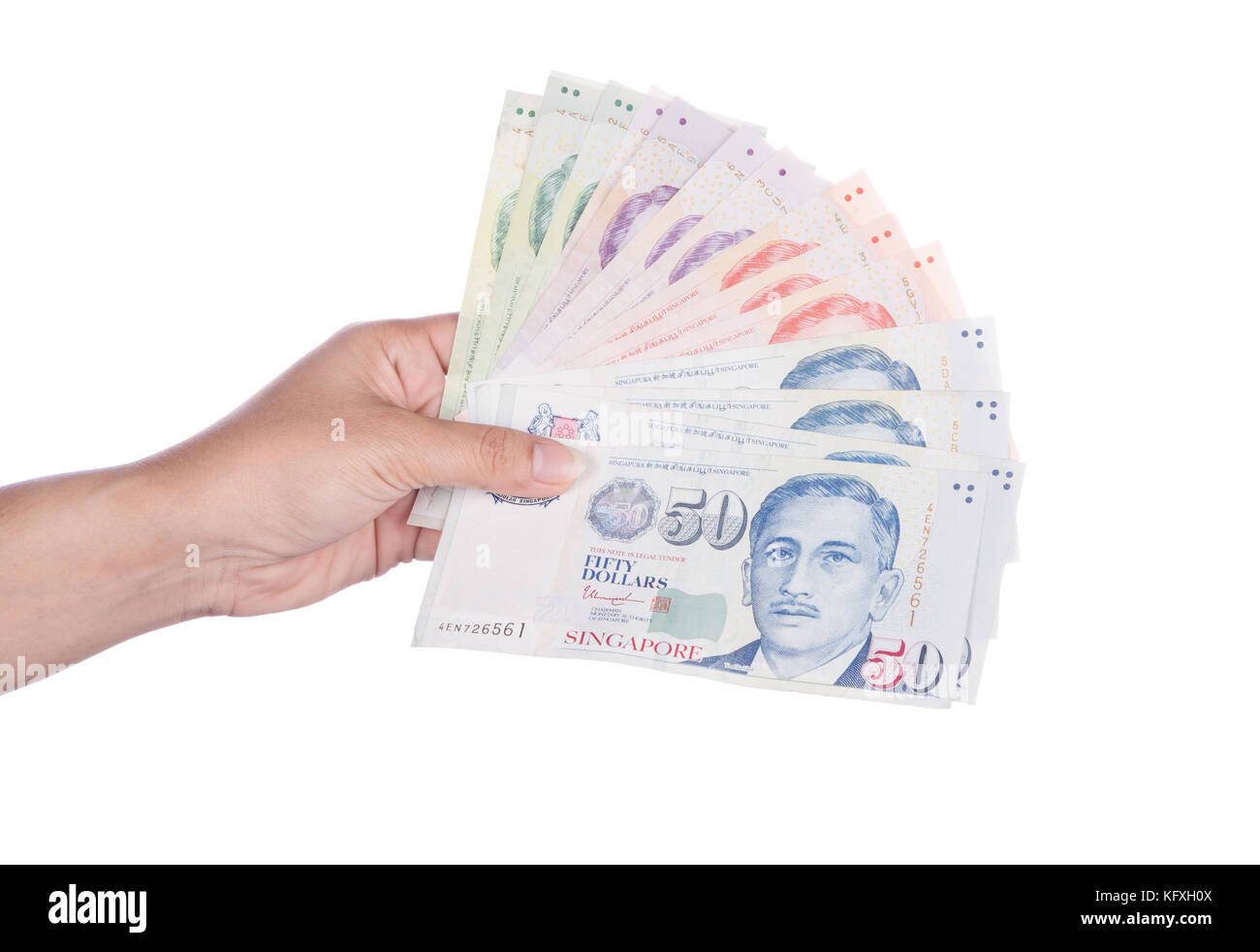 hand with Singapore banknotes dollars (SGD) isolated on a white ...