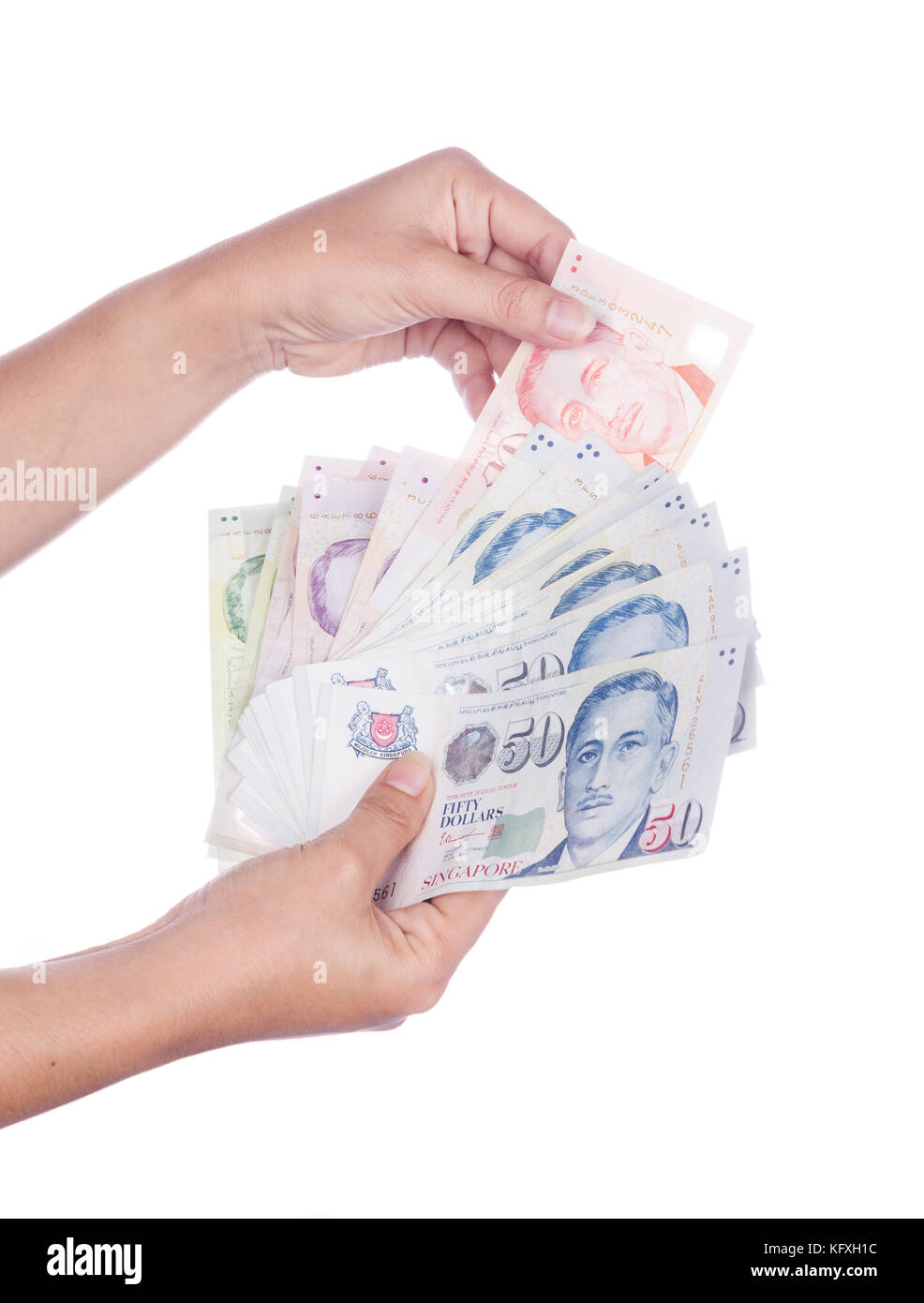 hand with Singapore banknotes dollars (SGD) isolated on a white ...
