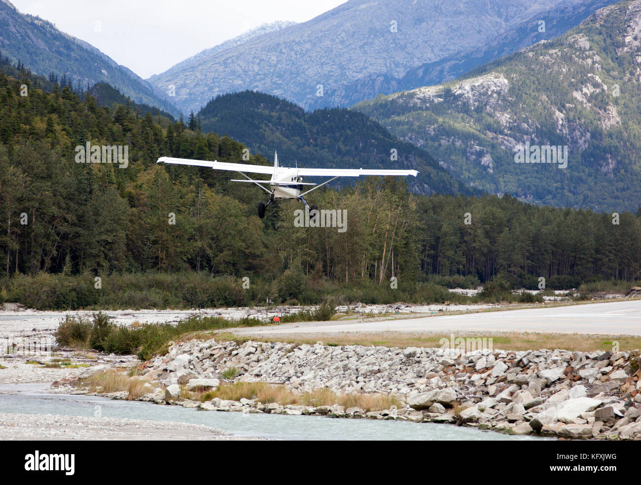 The little airplane is landing in Skagway town airport built by Skagway ...