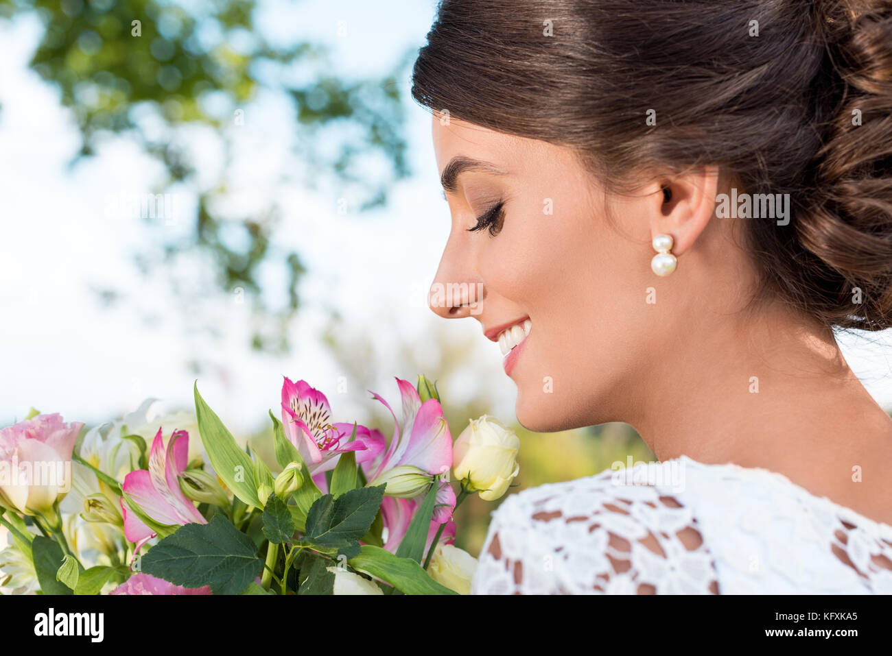 tender woman with bouquet of flowers Stock Photo - Alamy