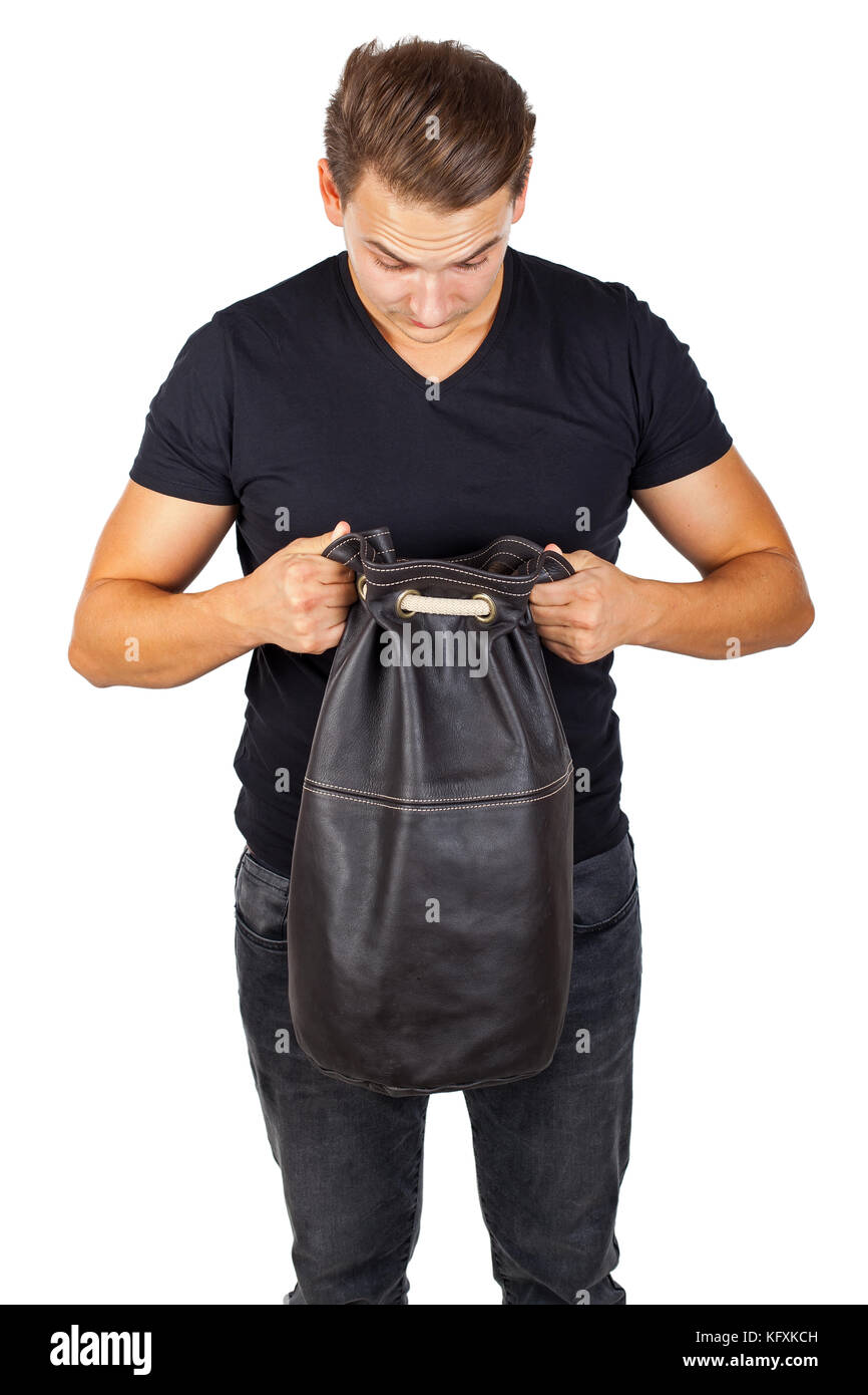 Photo of a happy man holding his brown leather backpack Stock Photo - Alamy