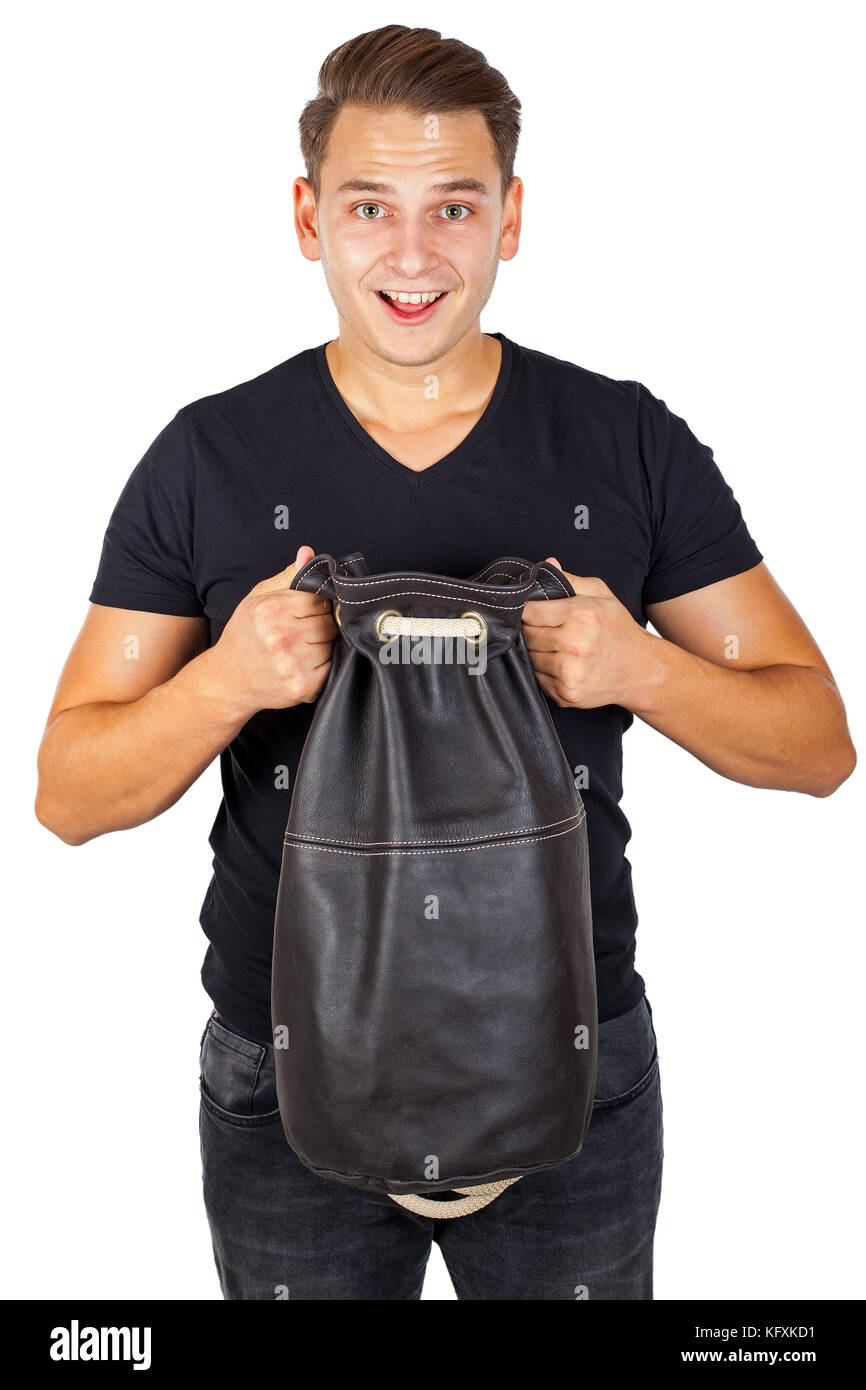 Photo of a happy man holding his brown leather backpack Stock Photo - Alamy