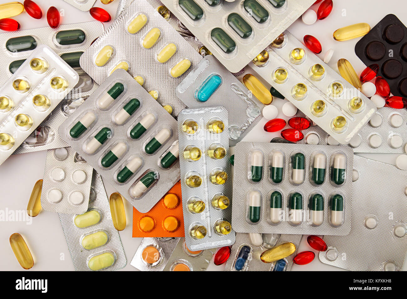 Heap of assorted various medicine tablets and pills in blisters ...