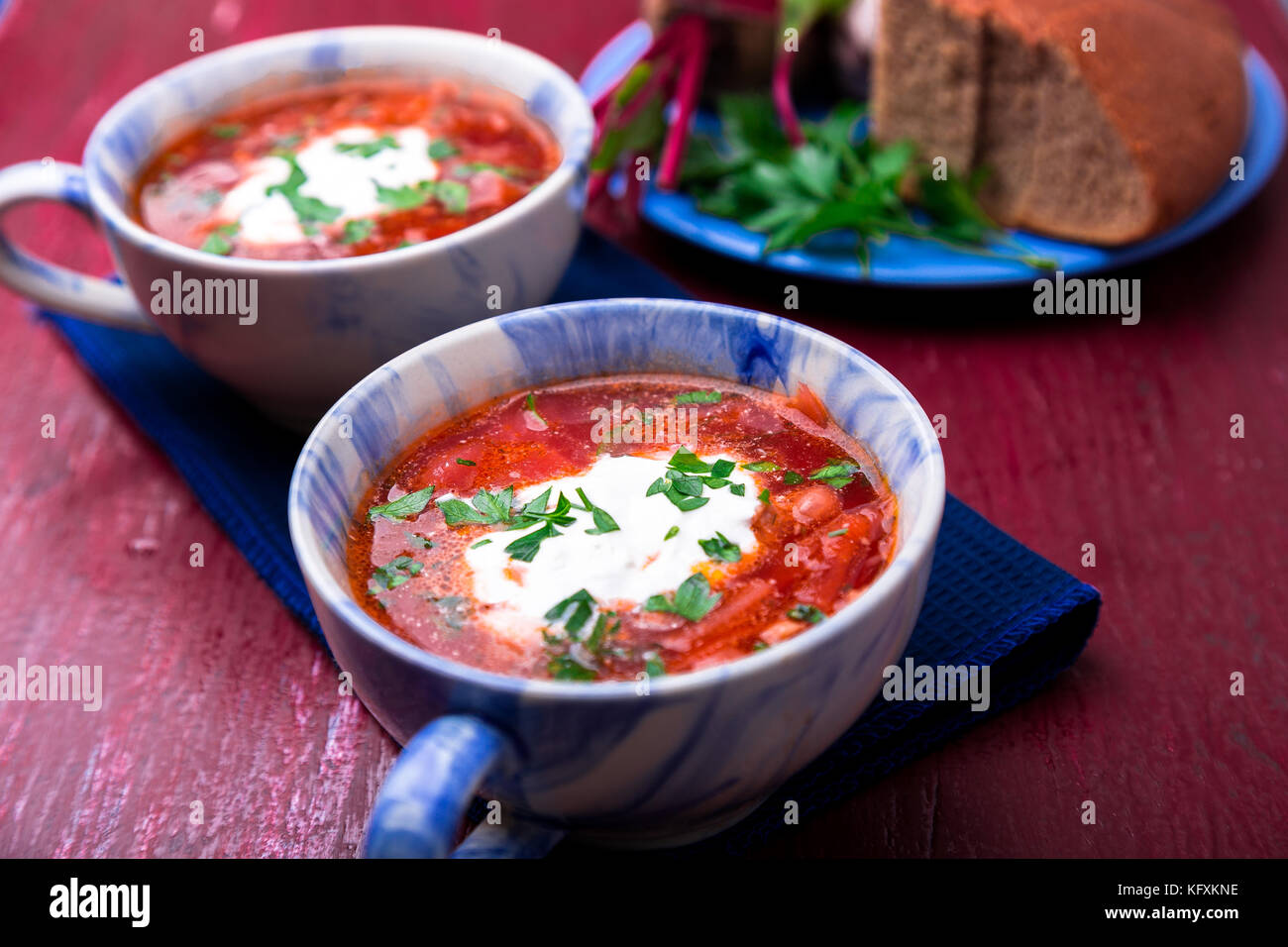 Ukrainian traditional borsch. Russian vegetarian red soup in blue bowl ...