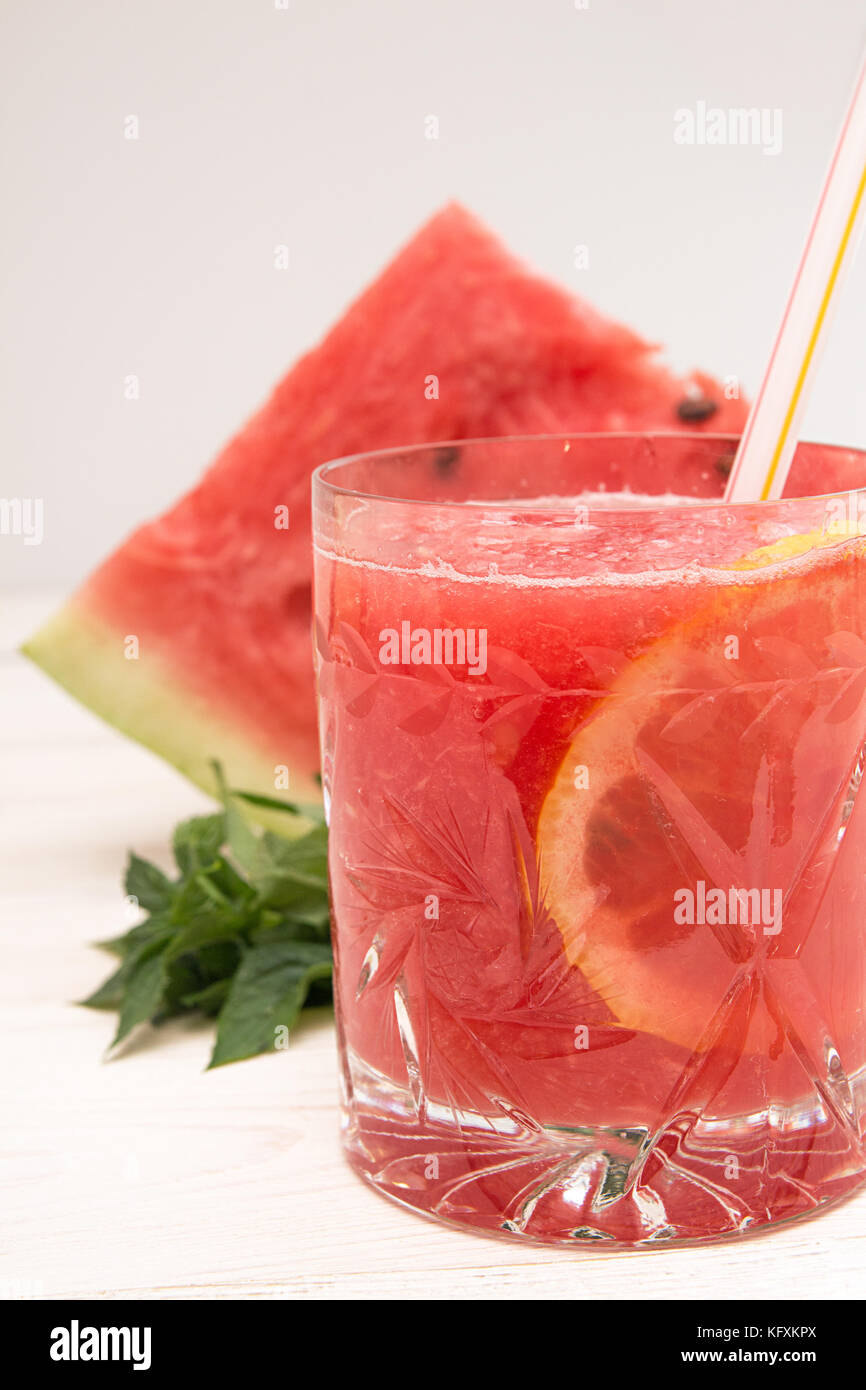 Summer drink watermelon smoothie juice in glass with cocktail tube and ...