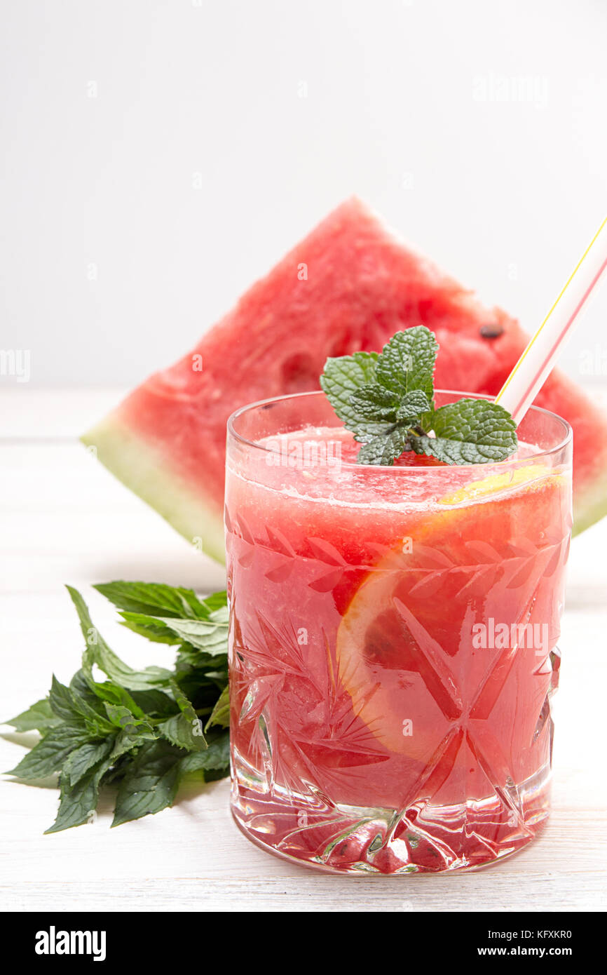 Summer drink watermelon smoothie juice in glass with cocktail tube and ...