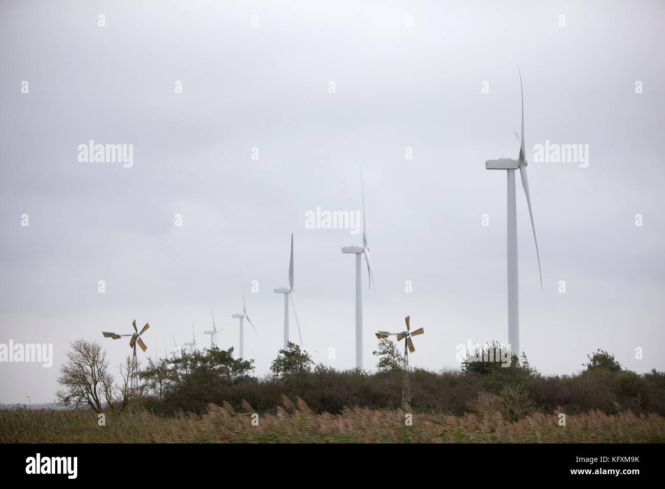 old small windmills and large wind turbines in the netherlands Stock ...