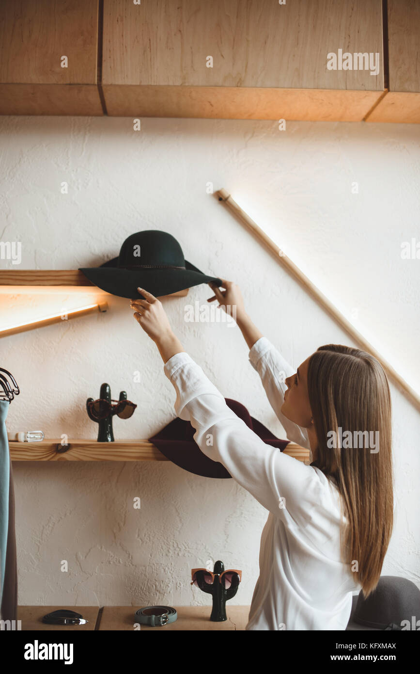 woman choosing hat Stock Photo - Alamy