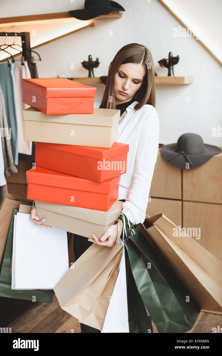 woman with shopping bags and boxes Stock Photo - Alamy