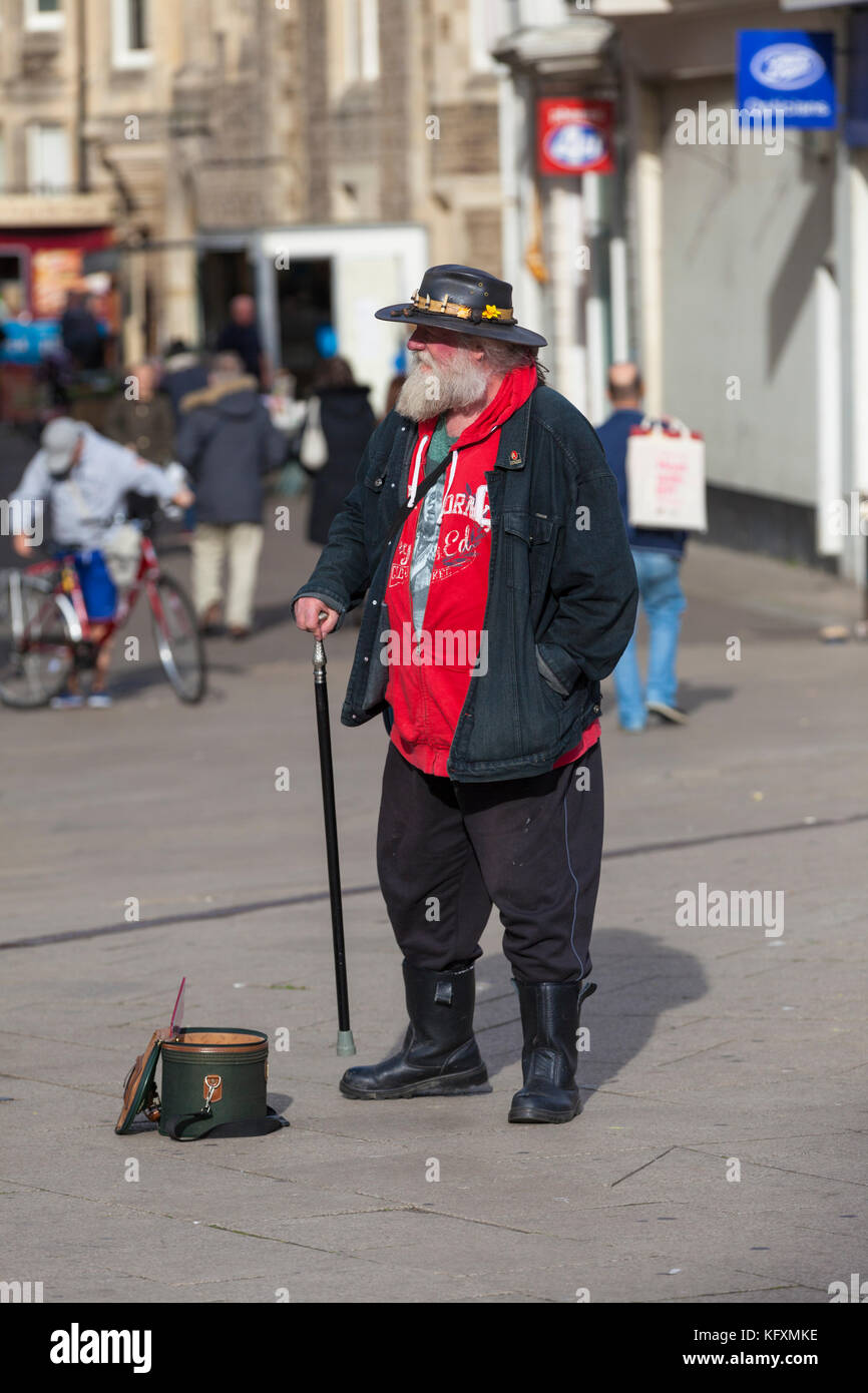 Elderly man with a cane in Hastings town centre Stock Photo - Alamy