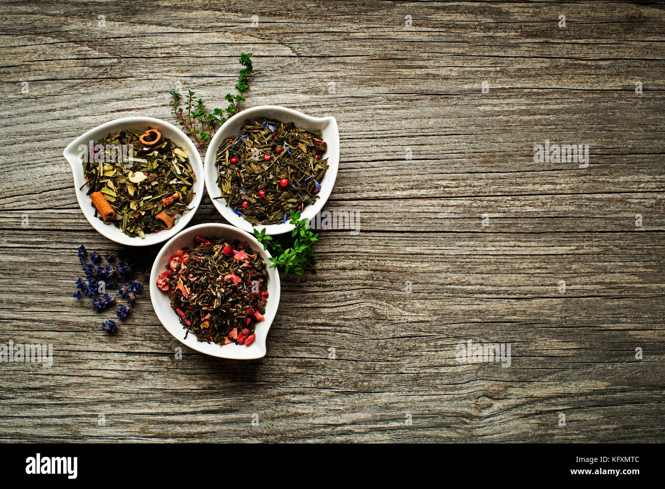 Dry tea collection of different types on wooden background Stock Photo ...