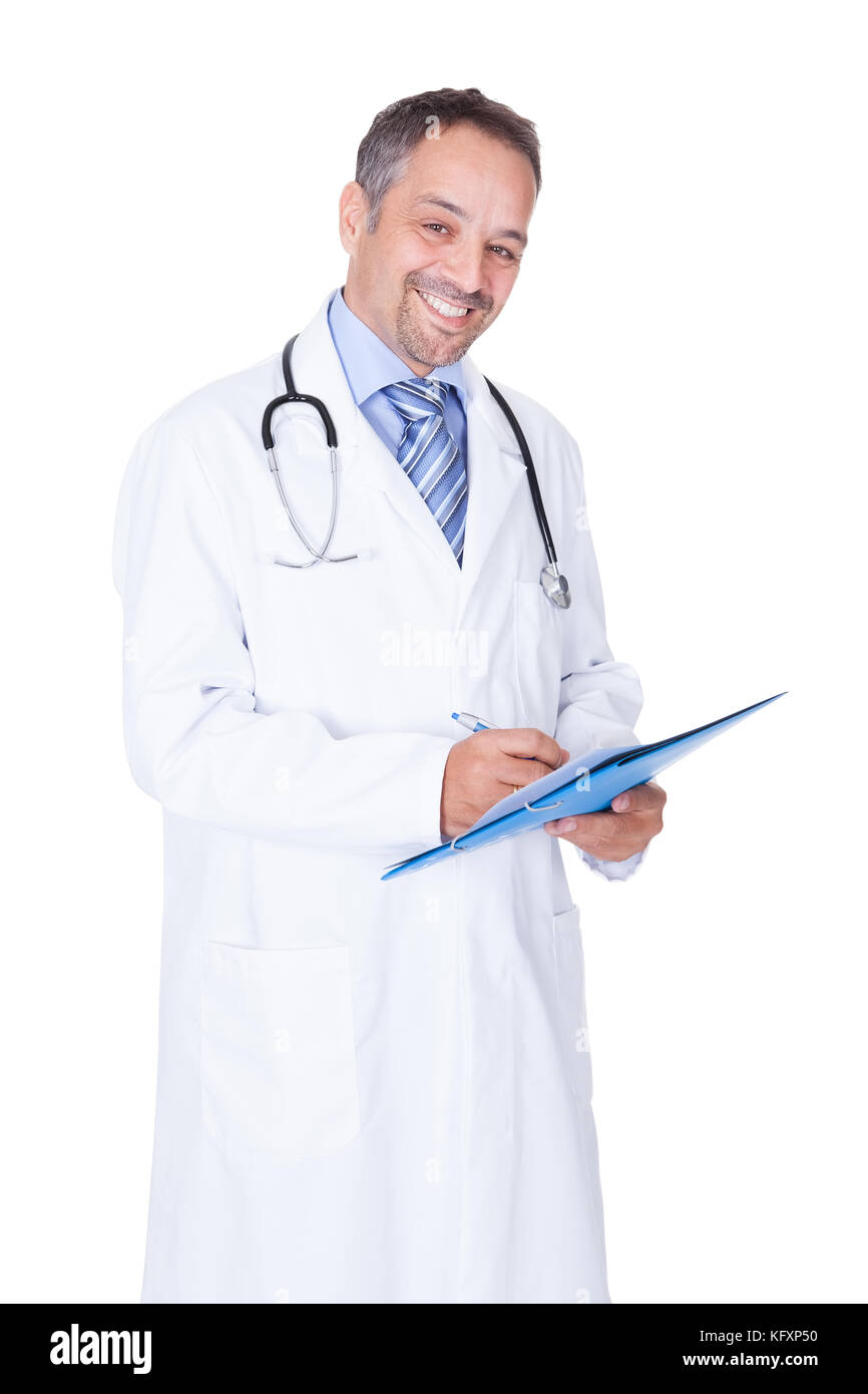 Portrait Of Happy Doctor Writing On Paper Stock Photo - Alamy