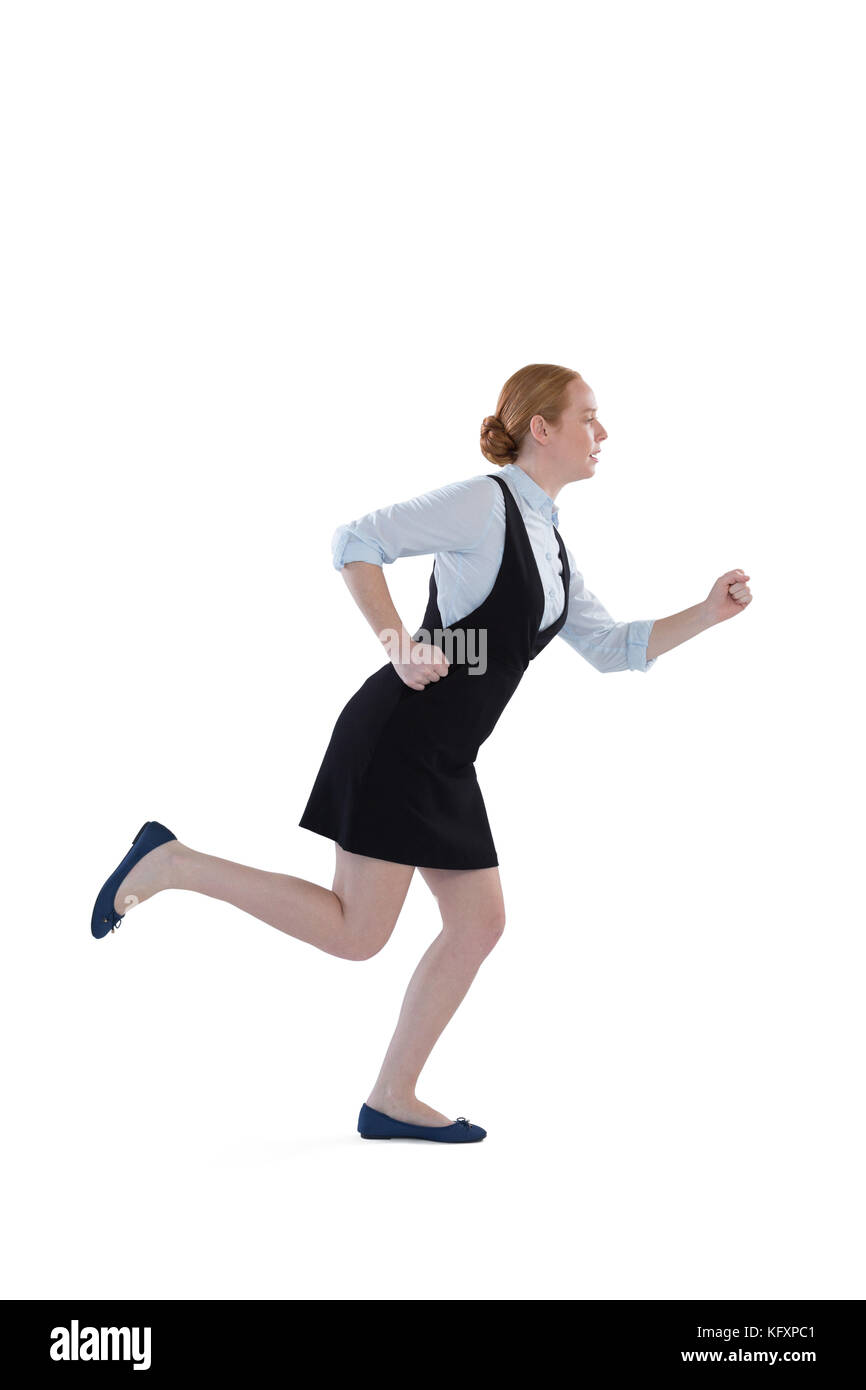 Young female executive running against white background Stock Photo - Alamy