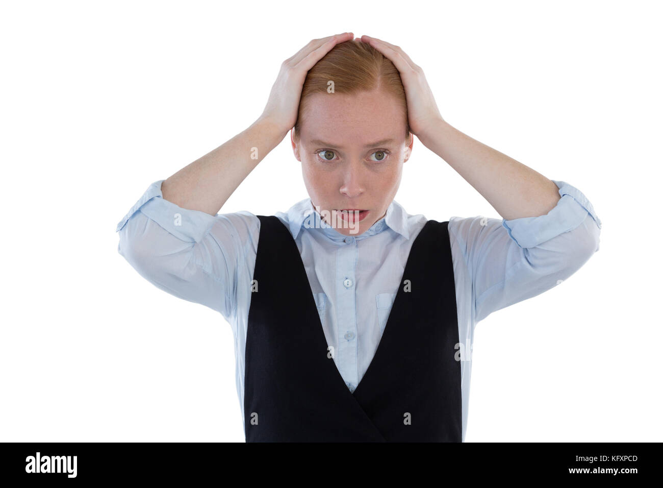 Upset young female executive standing against white background Stock ...