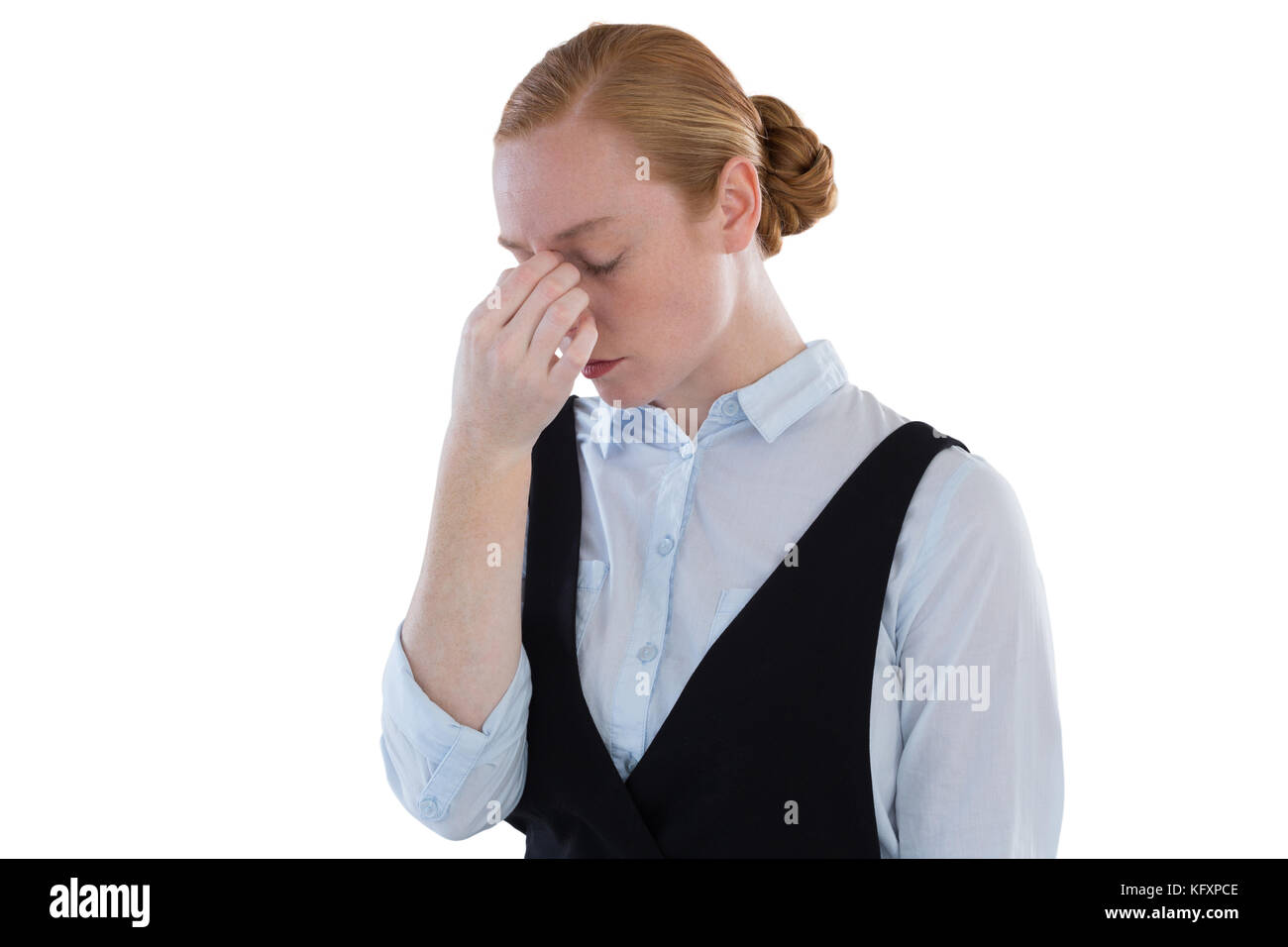 Upset young female executive standing against white background Stock ...