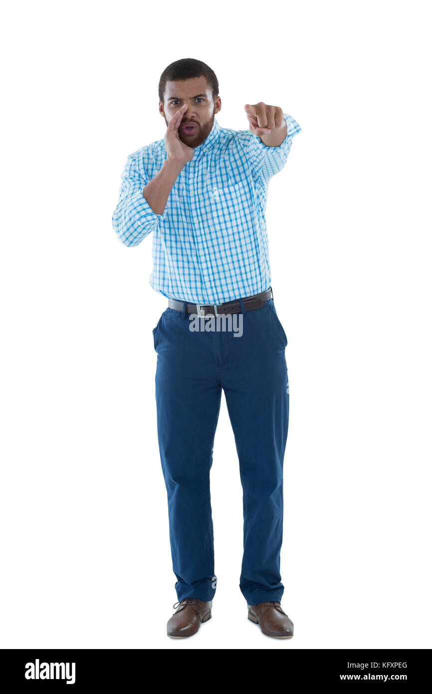 Young male executive shouting against white background Stock Photo - Alamy