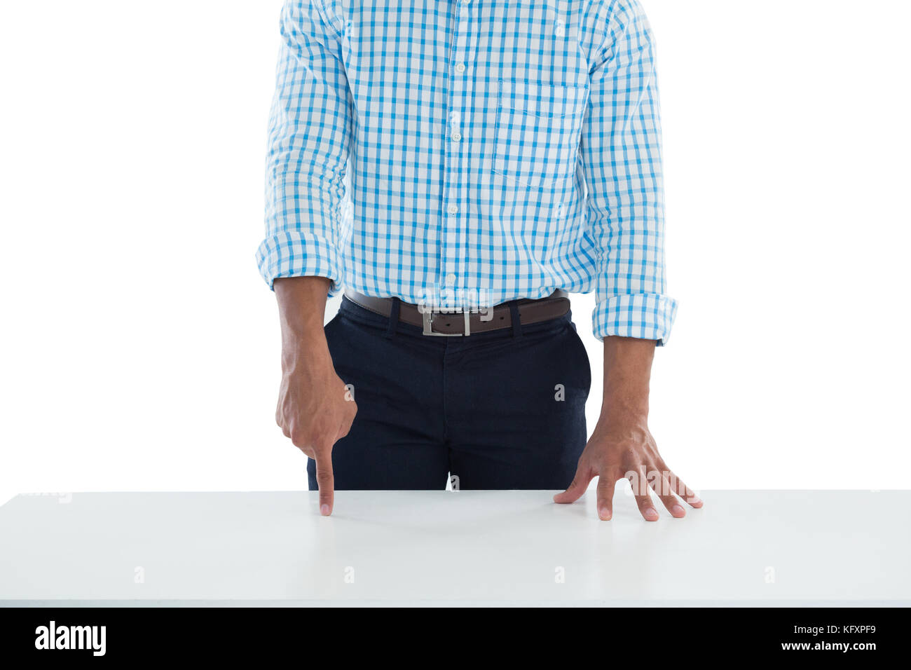 Mid-section of male executive touching invisible screen on desk Stock ...