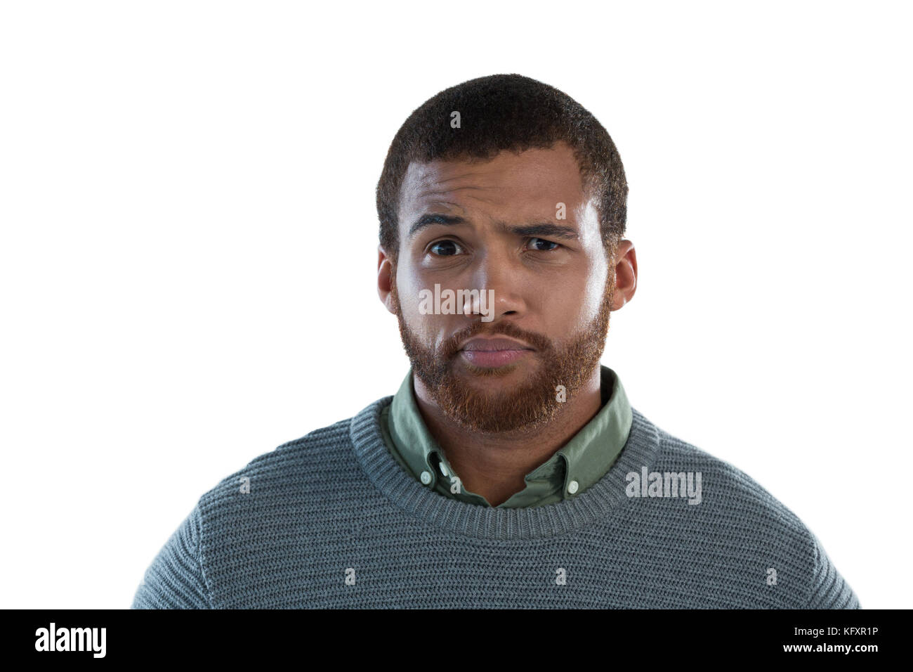 Portrait of confused man against white background Stock Photo - Alamy